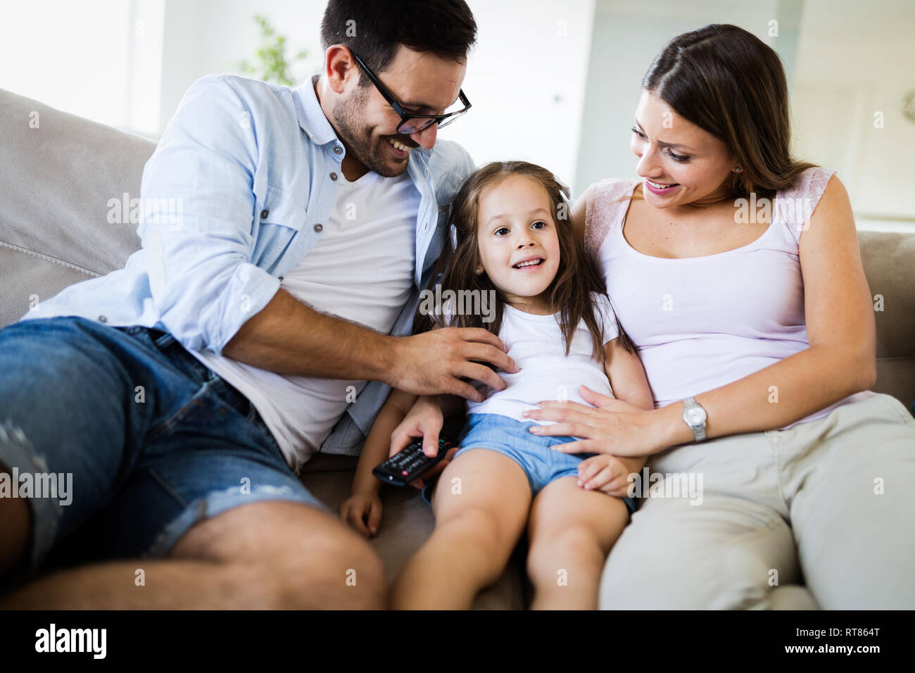 Happy family having fun time at home Stock Photo - Alamy