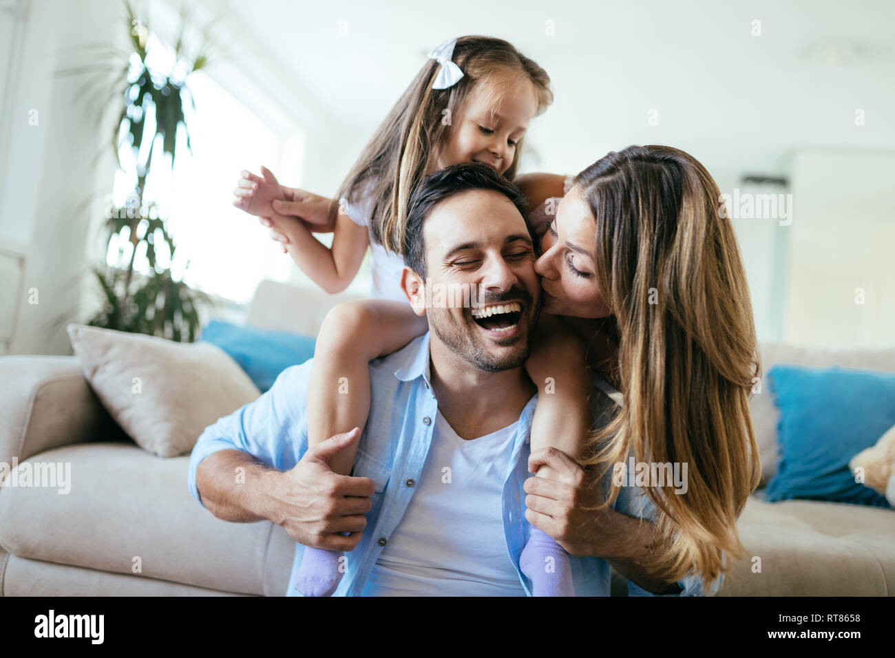 Happy family having fun time at home Stock Photo - Alamy