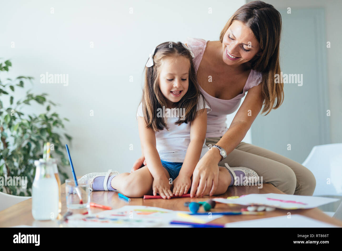 Happy family having fun time at home Stock Photo - Alamy