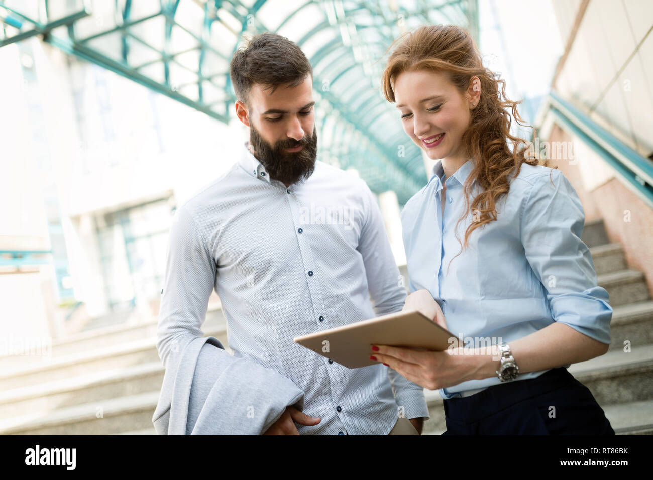 Picture of handsome man and beautiful woman as business partners Stock ...