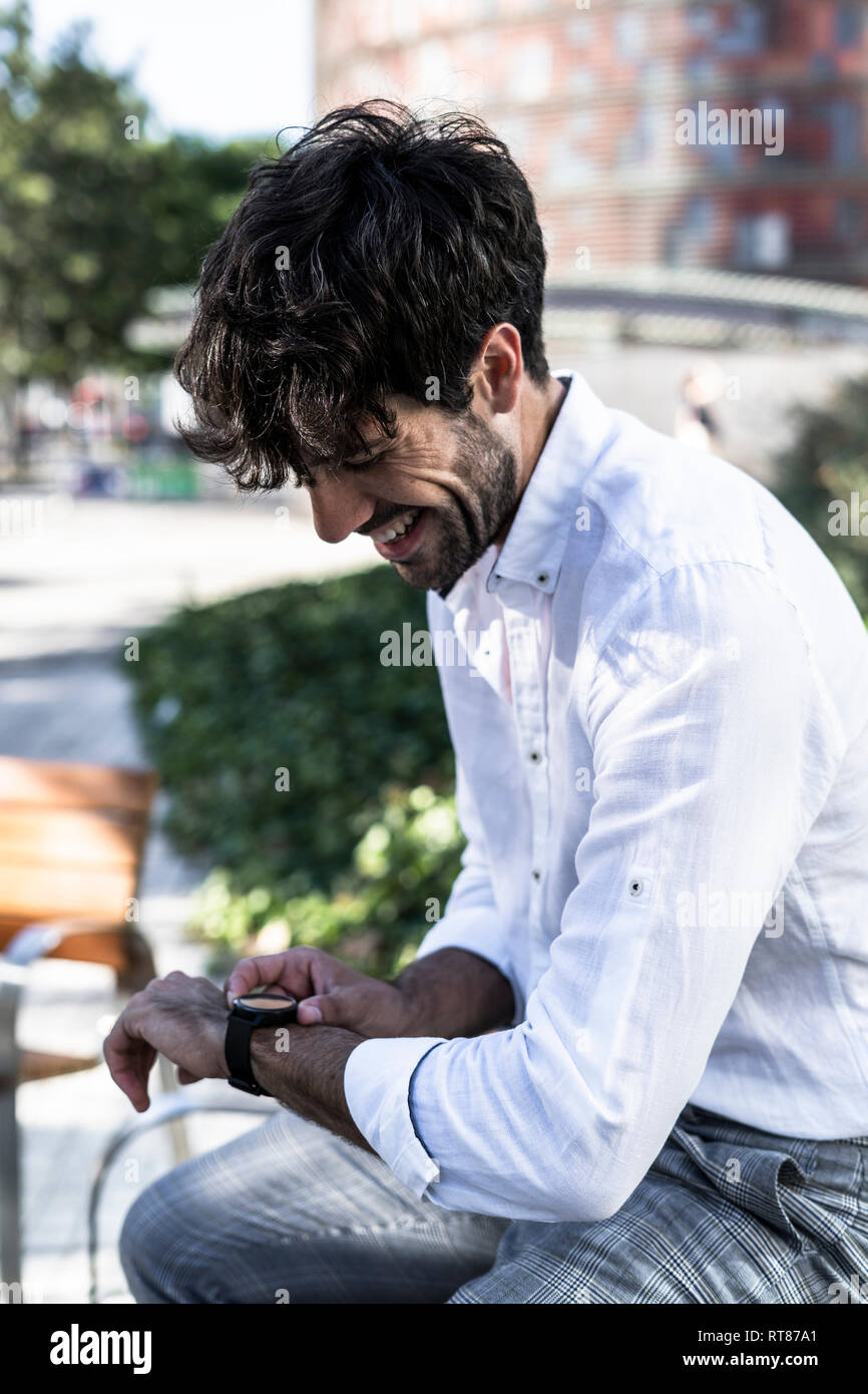 Young man using smartwatch hi-res stock photography and images - Alamy