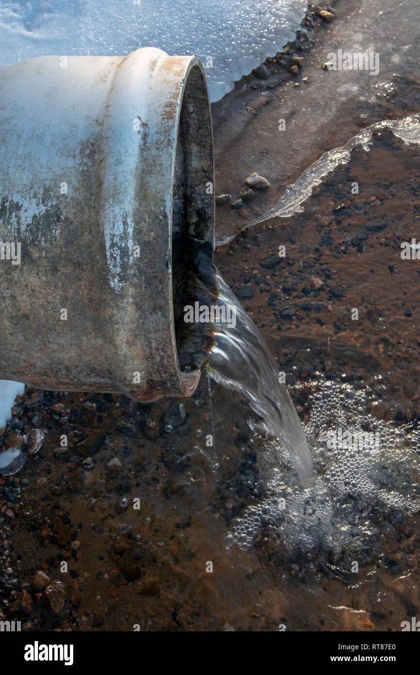 water running out of drain pipe into lake, Finland Stock Photo - Alamy