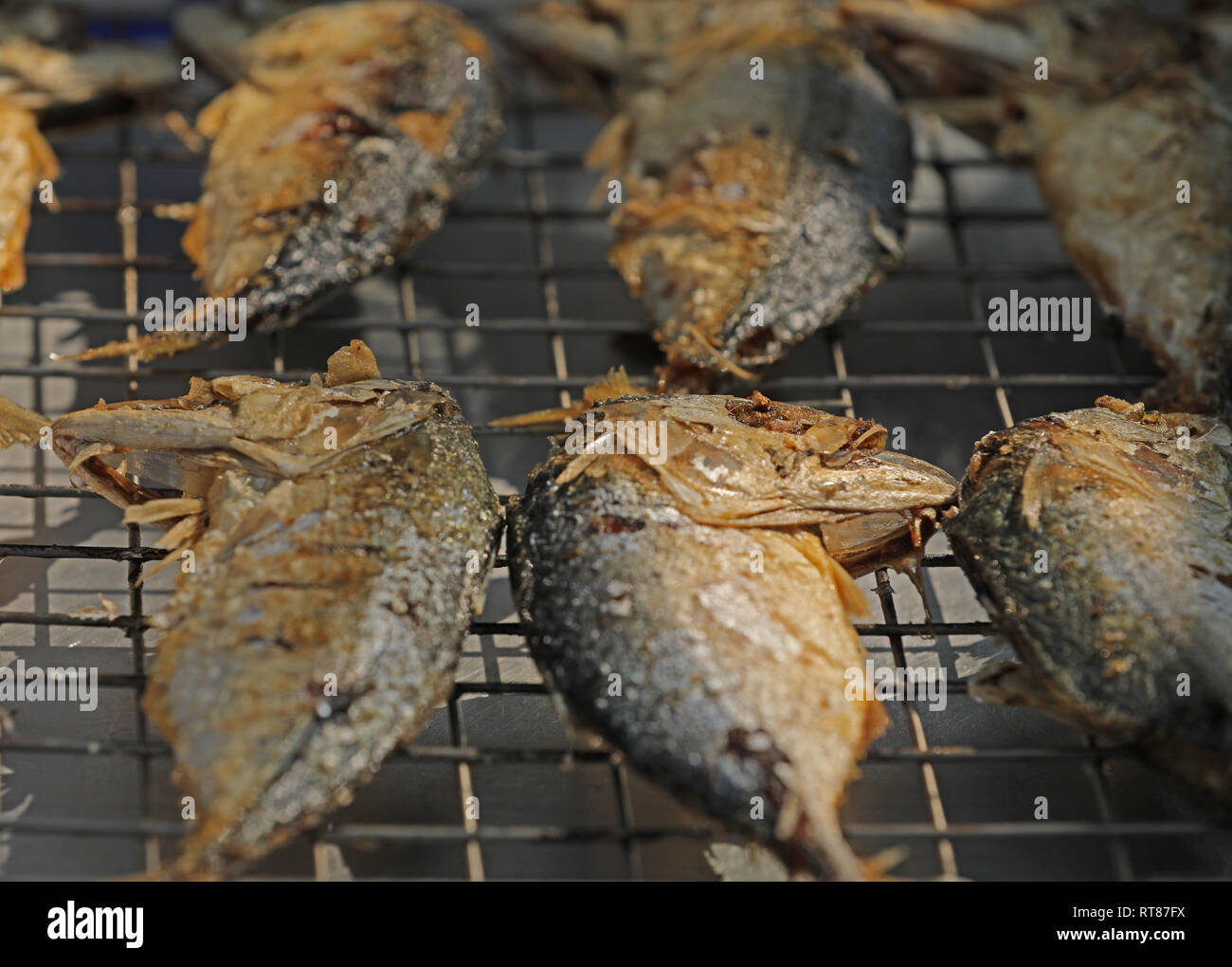 Grilled fried fish Stock Photo - Alamy