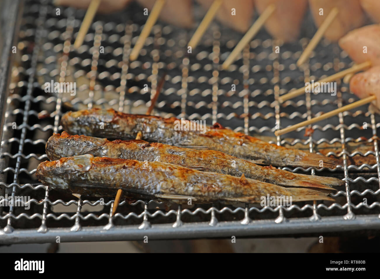 Grilled fried fish Stock Photo - Alamy