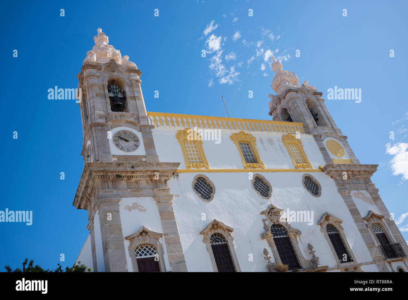 The Igreja do Carmo in Faro, with its Baroque façade and twin bell ...