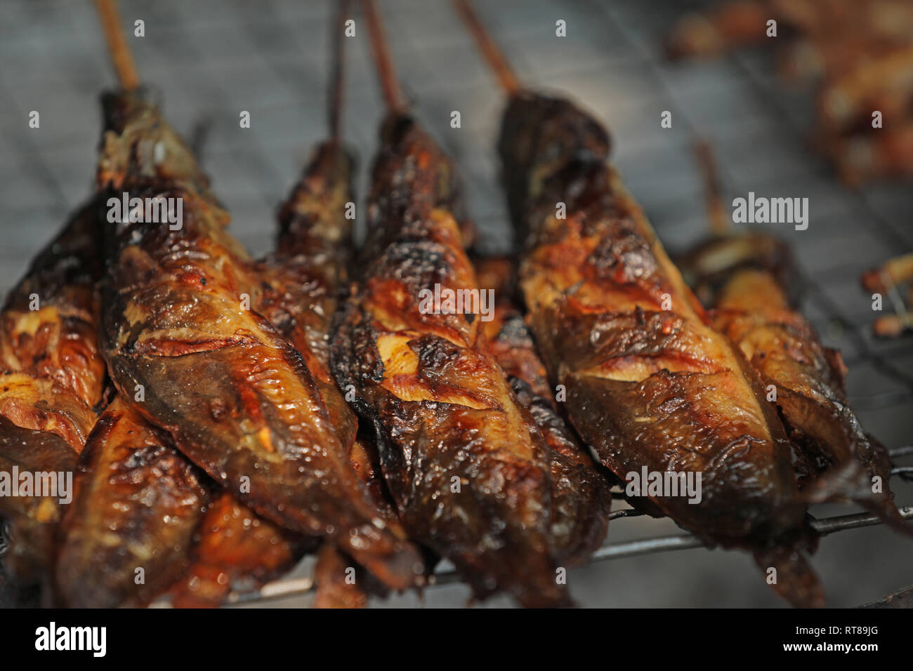 Grilled fried fish Stock Photo - Alamy
