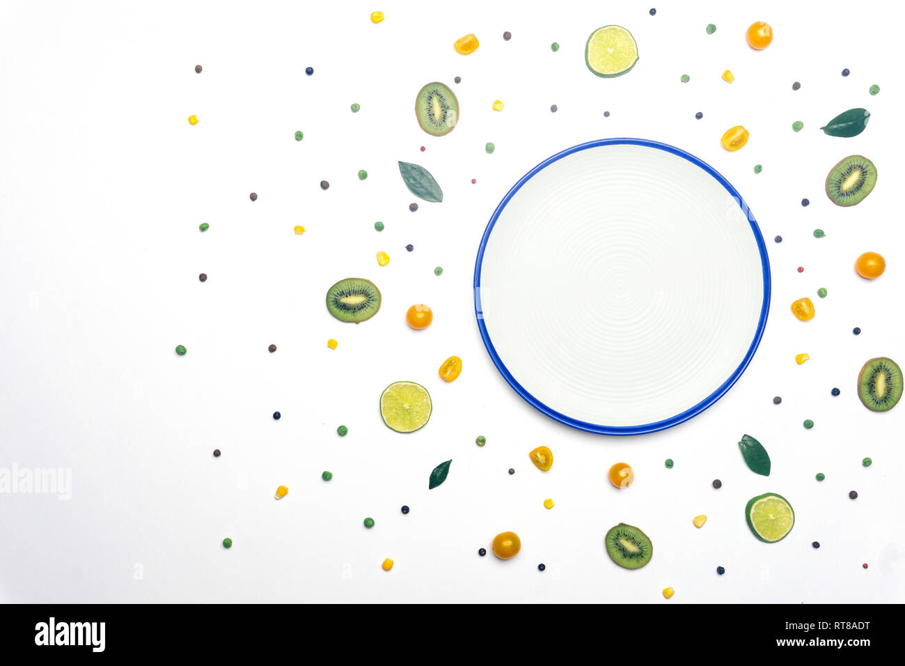 Food flat lay: spring summer concept with empty plate. Vegan vegetables ...