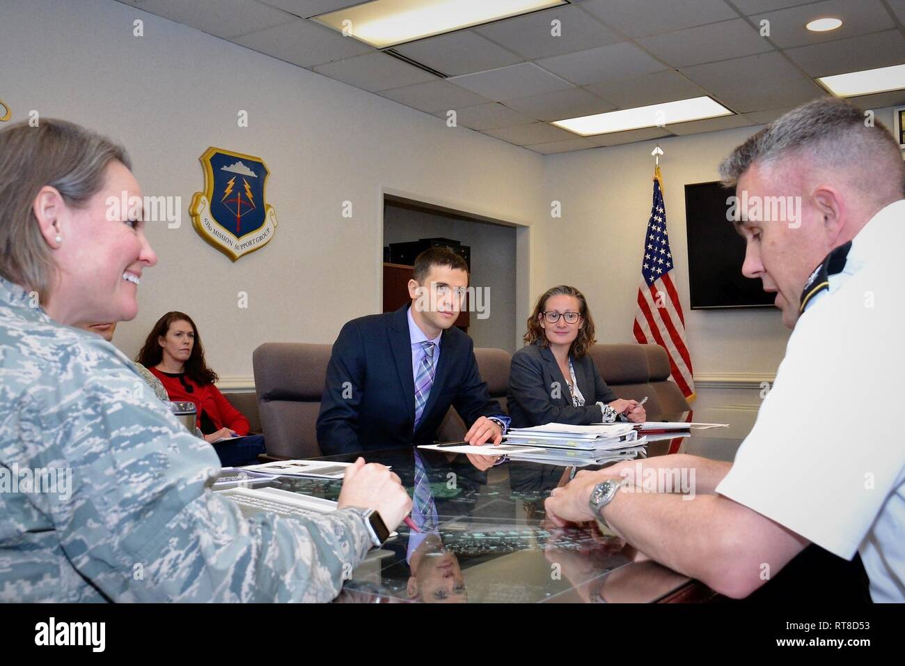Air Force Col. Erin Cluff, 633rd Mission Support Group commander, left ...