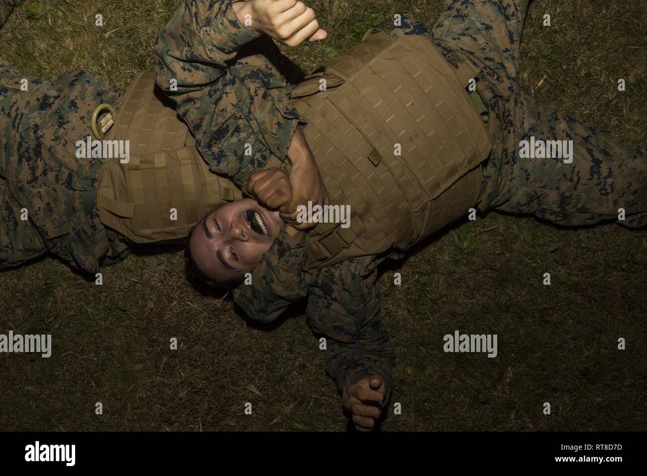 U.S. Marines with III Marine Expeditionary Force grapple during a ...