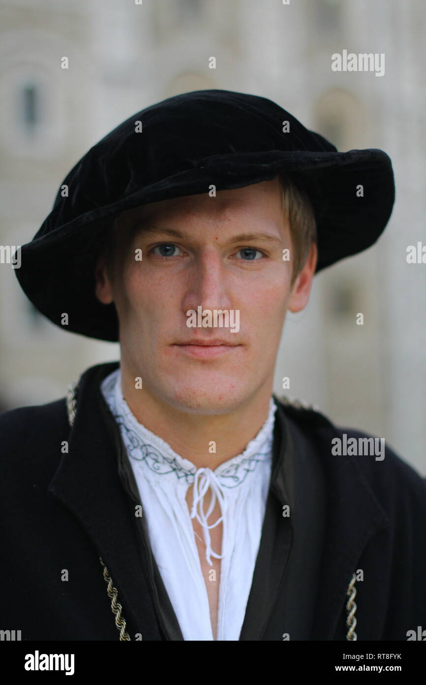 Portrait of a young Tudor man wearing authentic Tudor clothes poses ...
