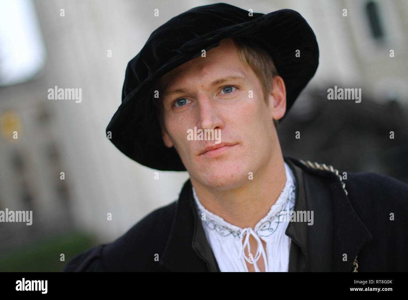 Portrait of a young Tudor man wearing authentic Tudor clothes poses ...
