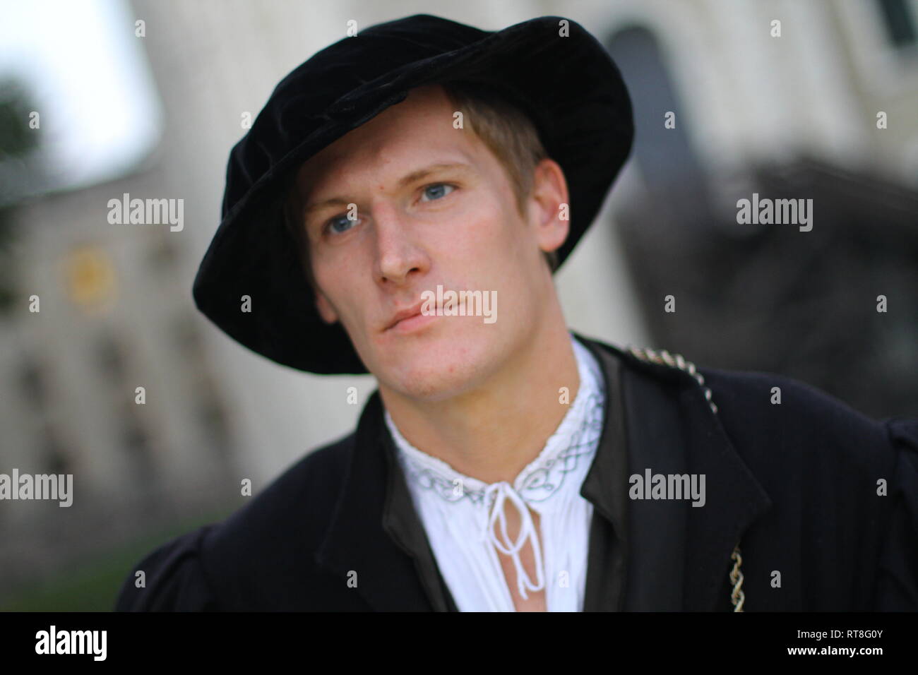 Portrait of a young Tudor man wearing authentic Tudor clothes poses ...