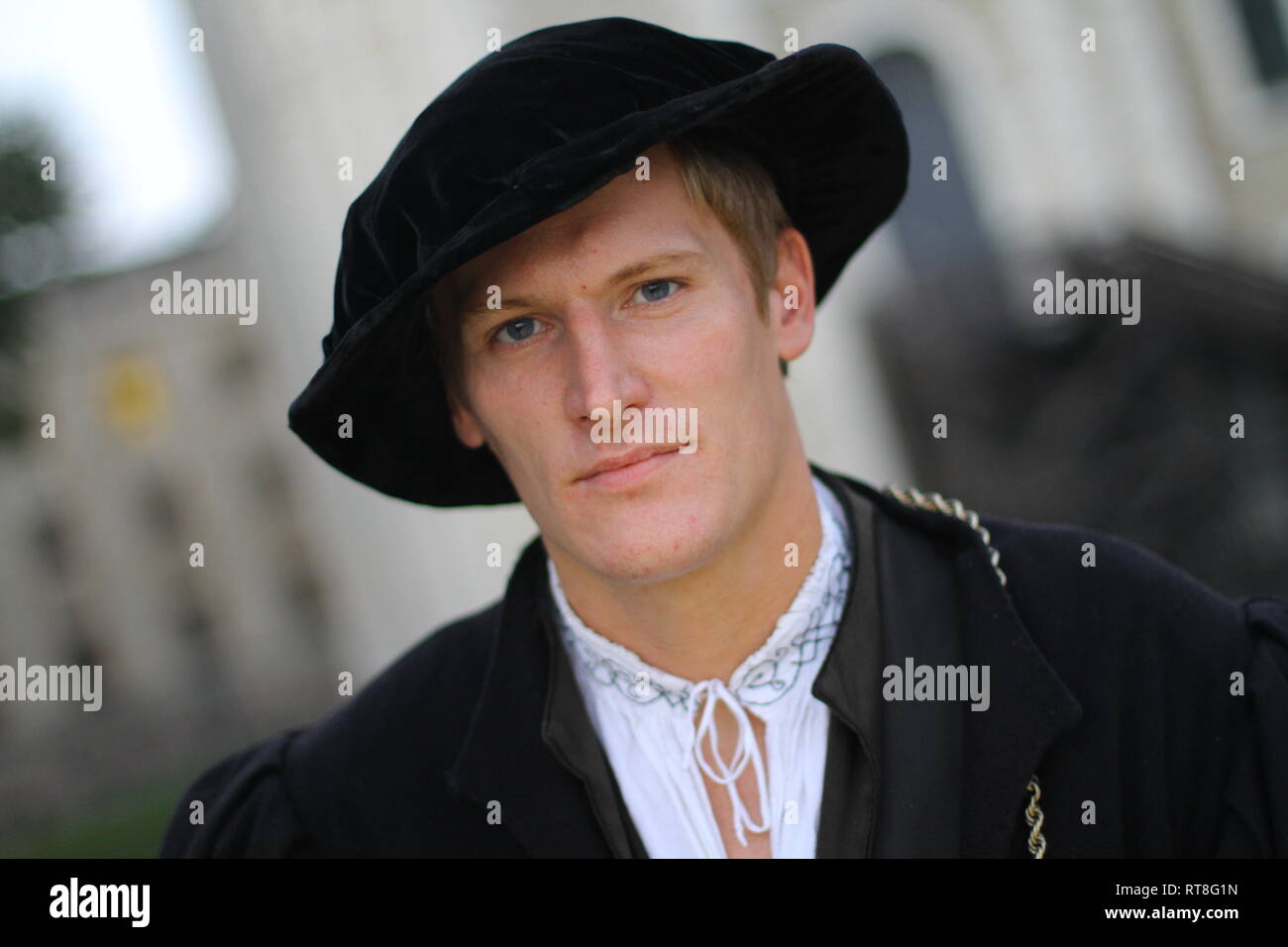 Portrait of a young Tudor man wearing authentic Tudor clothes poses ...
