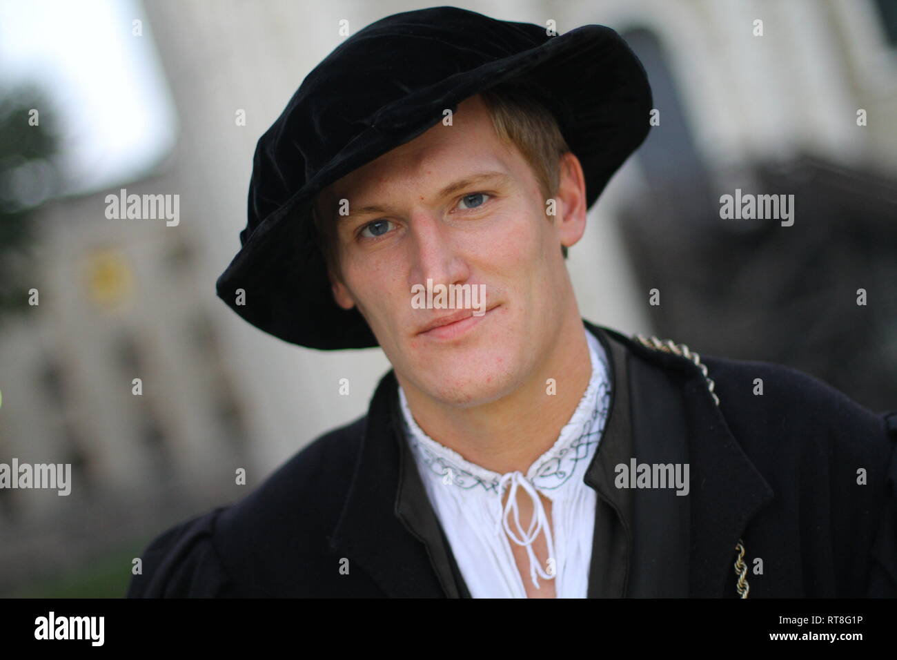 Portrait of a young Tudor man wearing authentic Tudor clothes poses ...