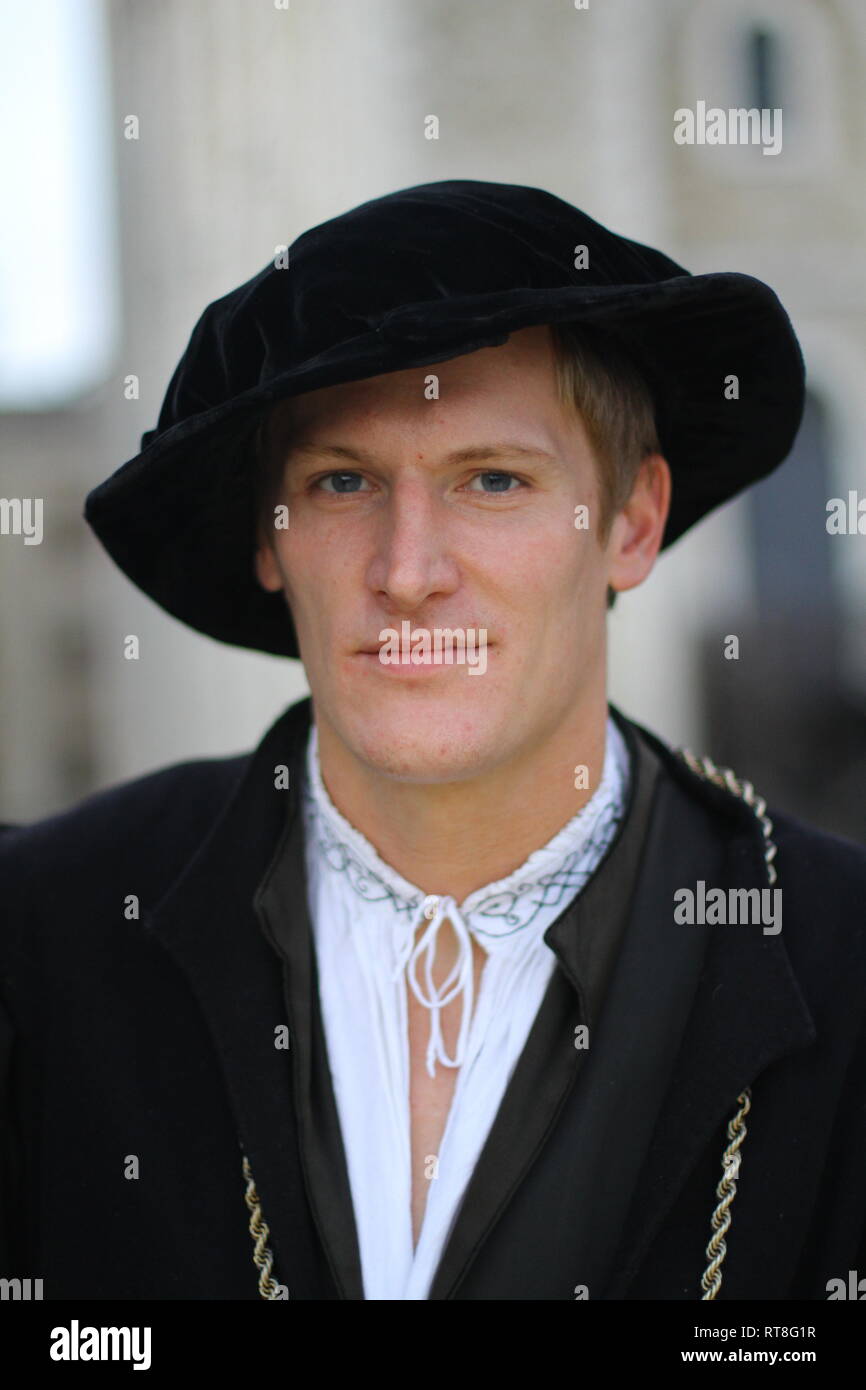 Portrait of a young Tudor man wearing authentic Tudor clothes poses ...