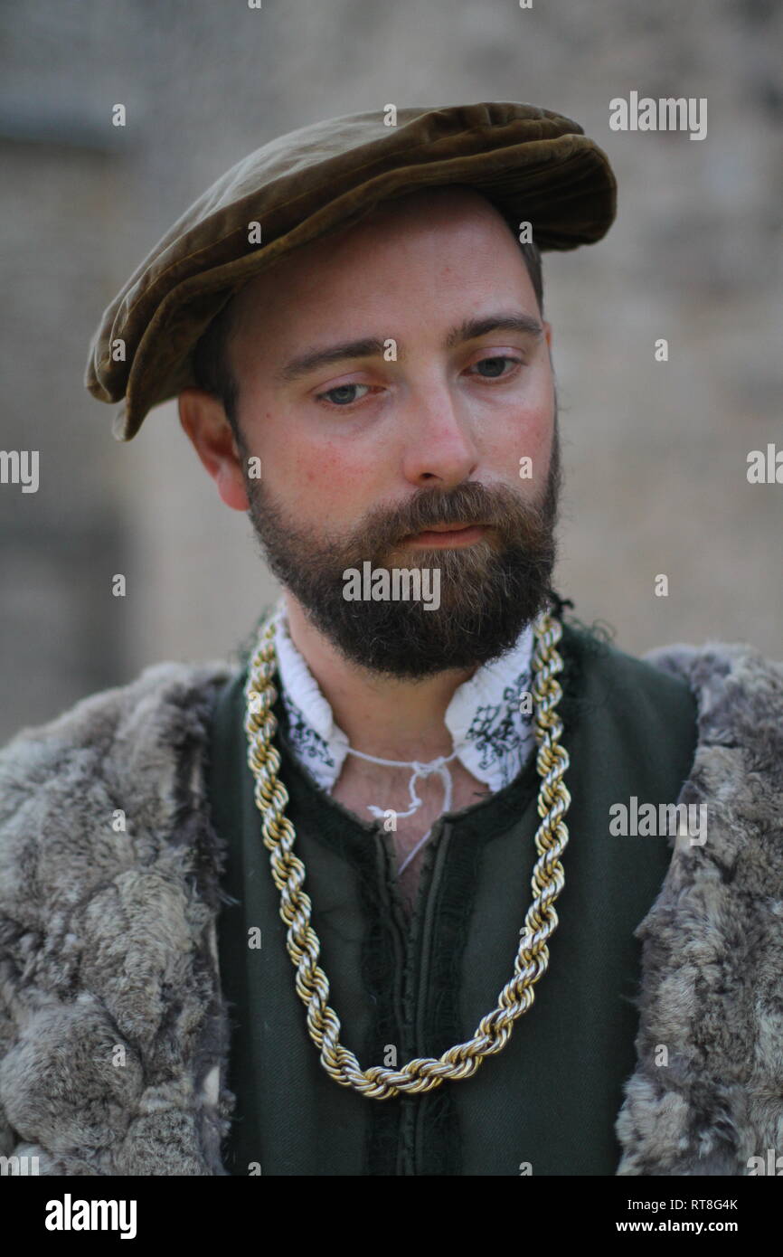 Portrait of a young Tudor man wearing authentic Tudor clothes poses ...