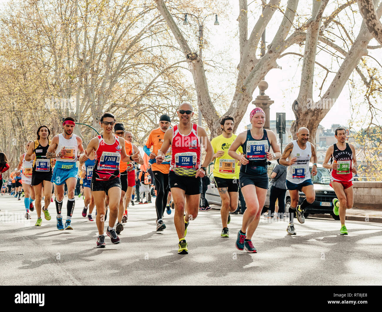 Rome, Italy - April 8, 2018: large group men and women runners run of ...