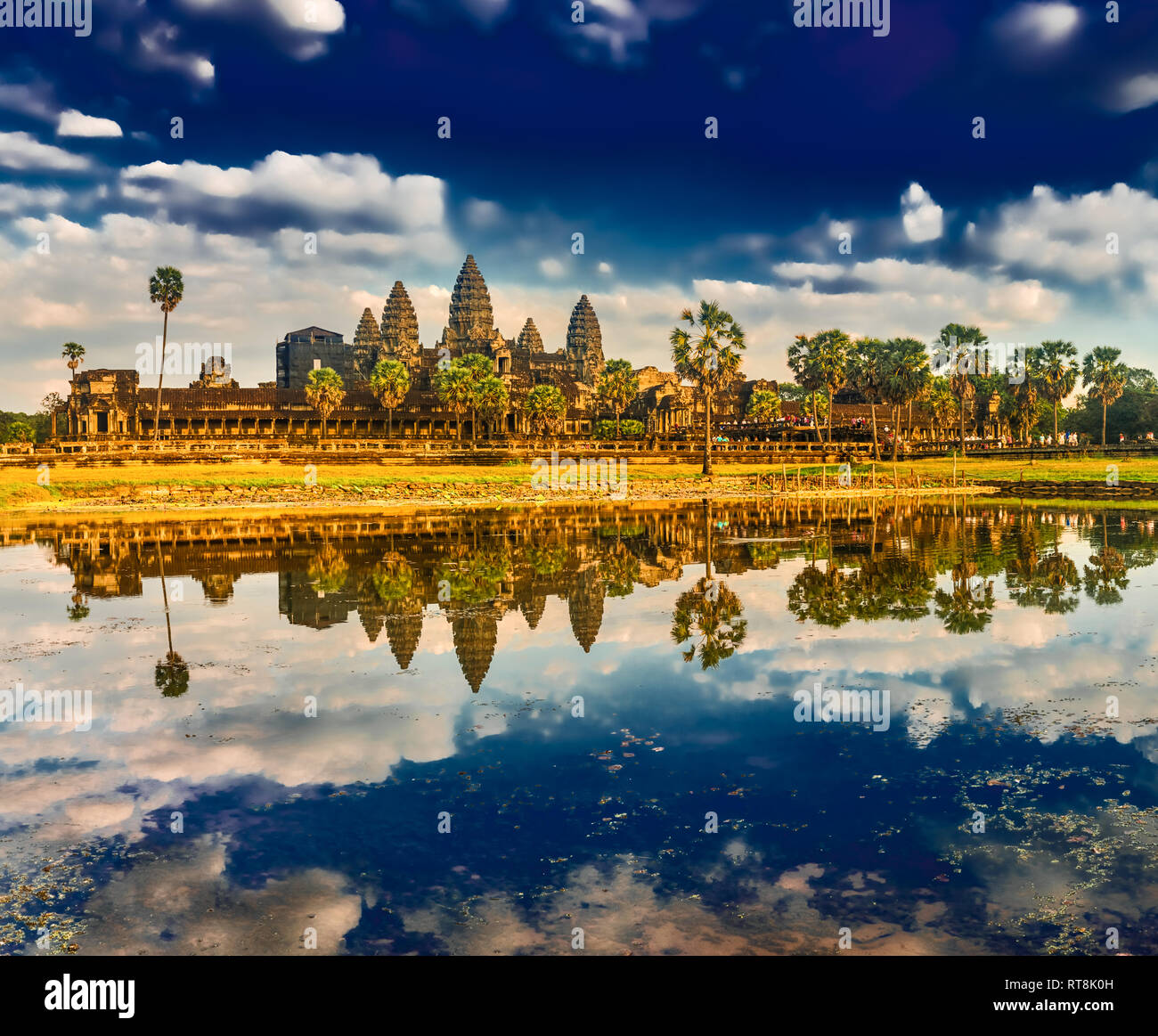 Angkor Wat temple reflecting in water of Lotus pond at sunset. Siem ...