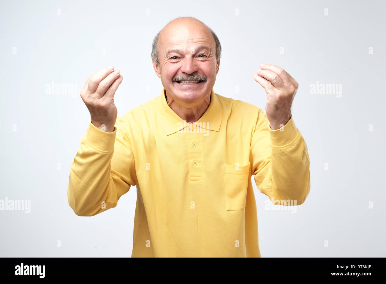 Attractive guy laughing, showing italian gesture, proving his point of ...