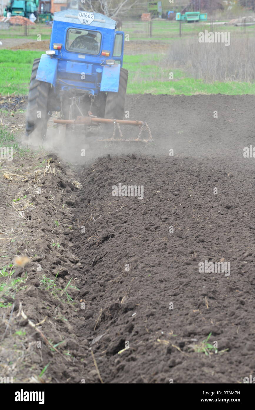 Tractor ploughing soil hi-res stock photography and images - Alamy