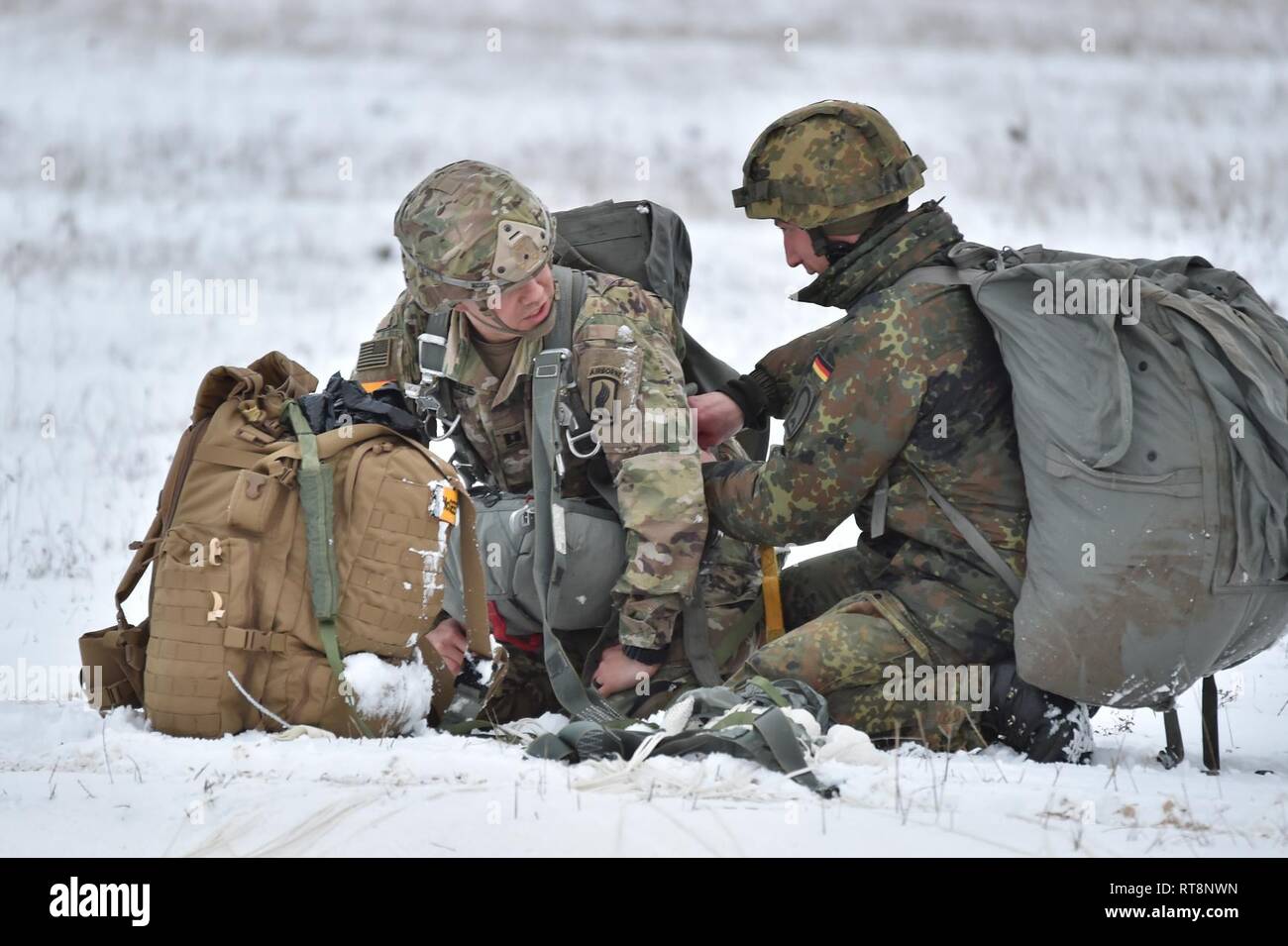A German, right, and a U.S. Paratrooper with 4th Battalion, 319th Field ...