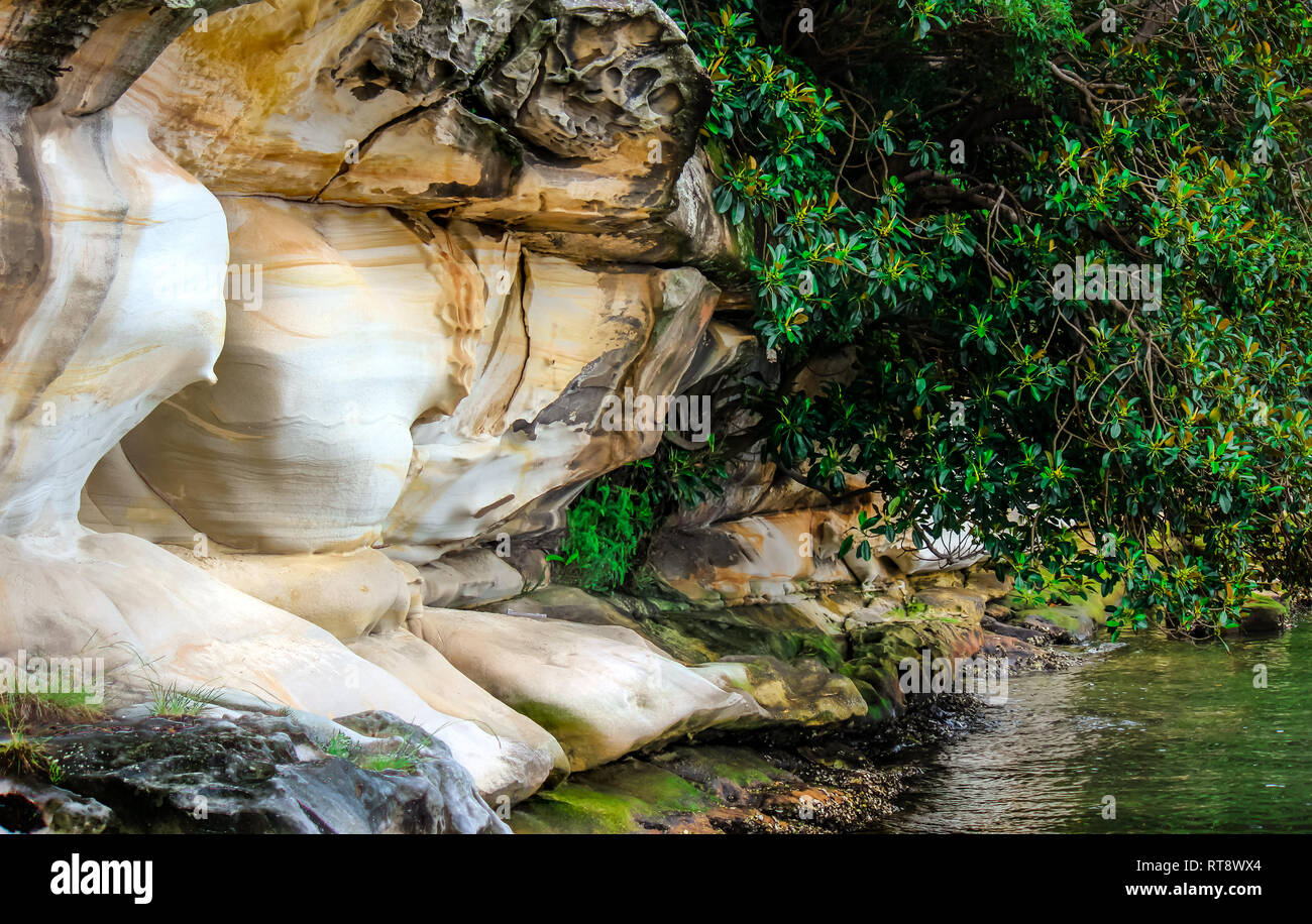 Rock formed by water in sydney australia Stock Photo - Alamy