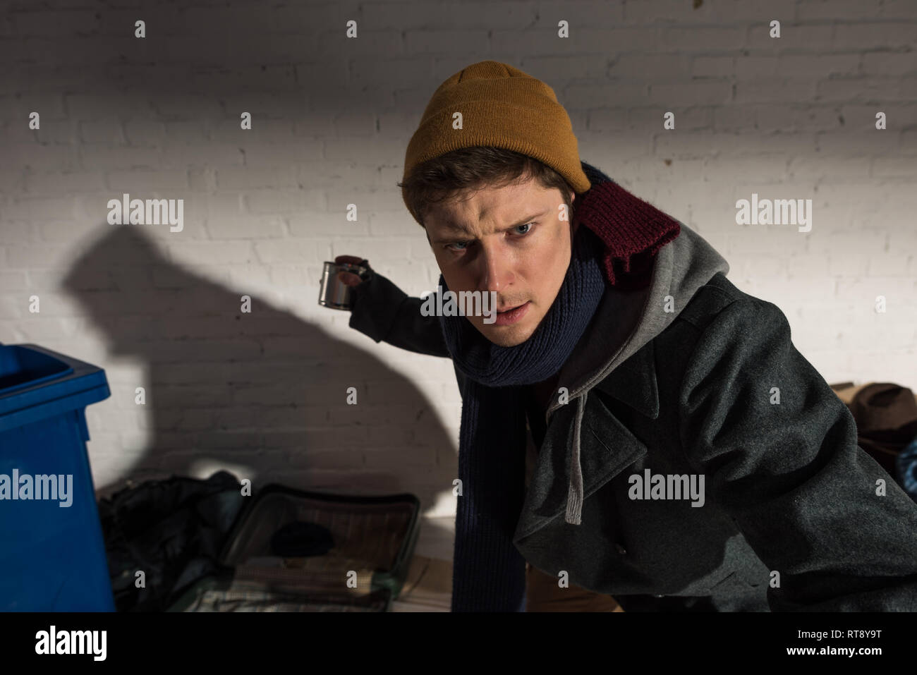 angry drunk homeless man standing in threatening pose on rubbish dump ...