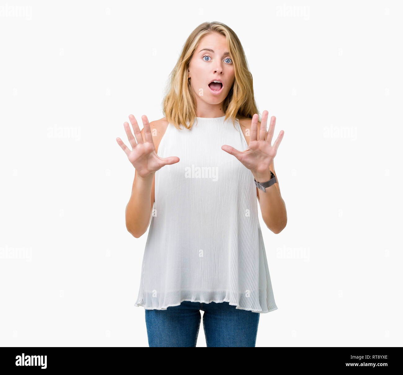 Beautiful young elegant woman over isolated background afraid and ...