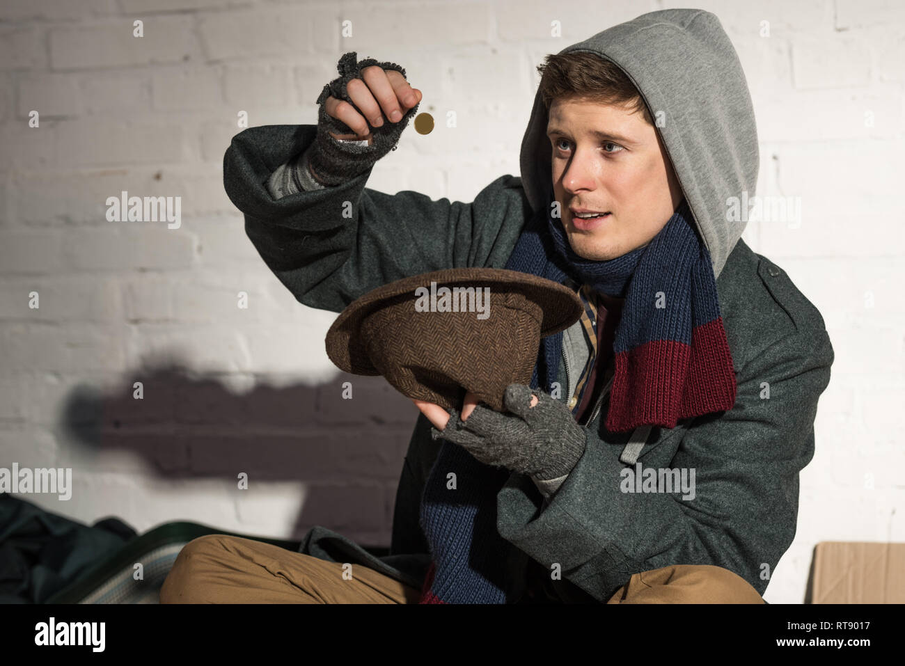 Homeless money hat hi-res stock photography and images - Alamy