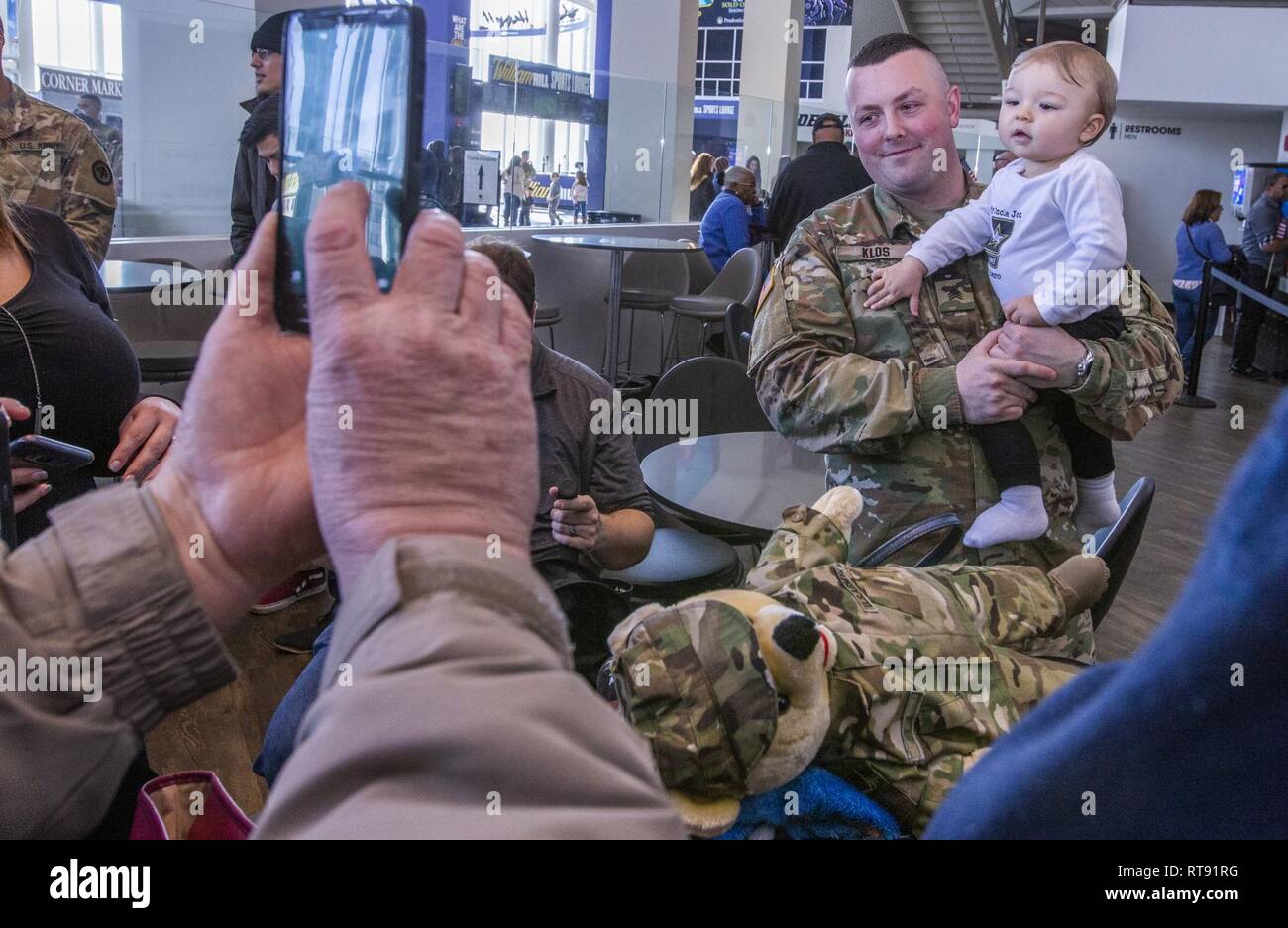 U.S. Army Sgt. Jonathan T. Klos, 2nd Battalion, 113th Infantry, has his ...