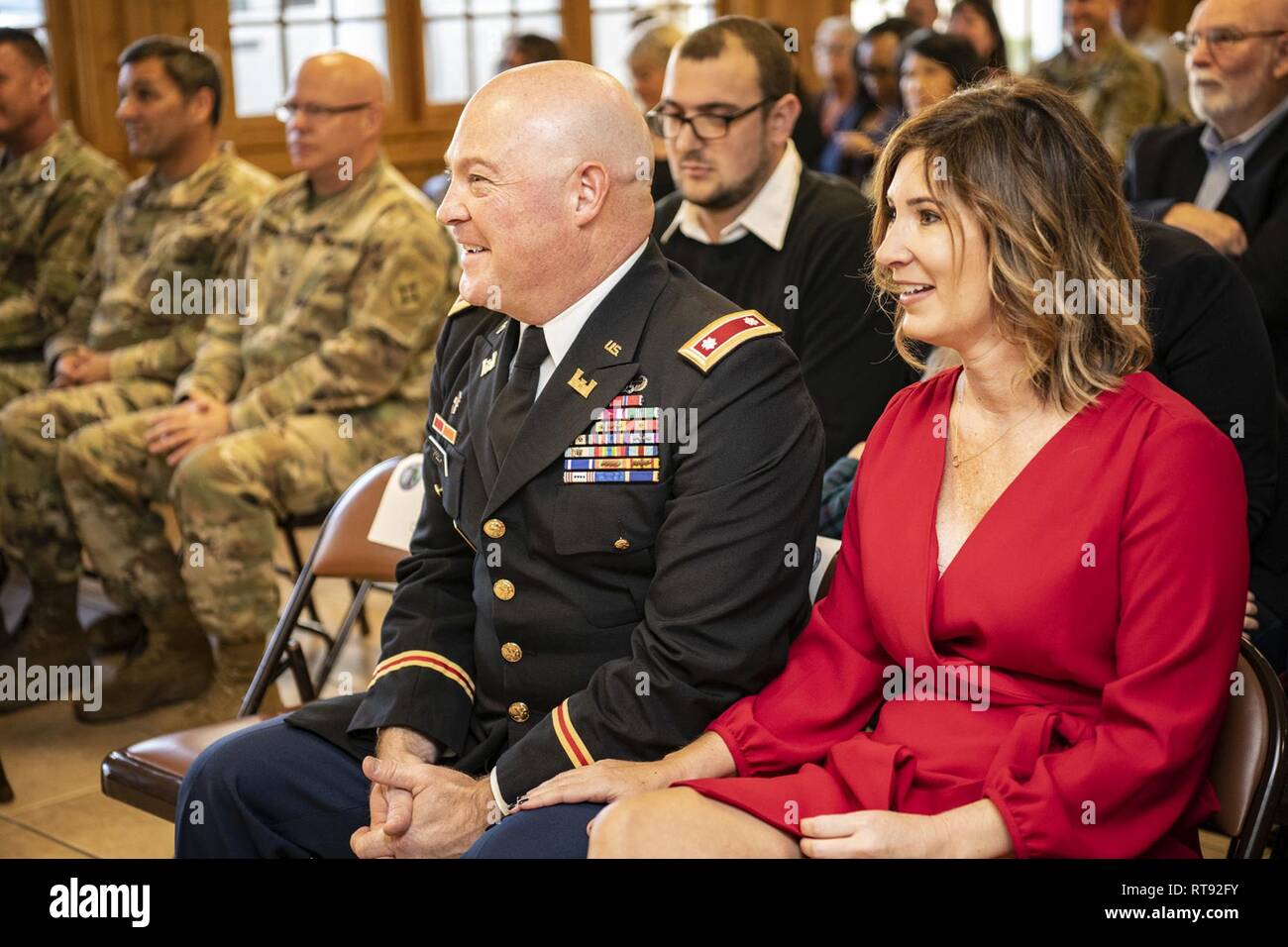 Kevin Creech sits with wife Roxanne in front of a large crowd for his ...