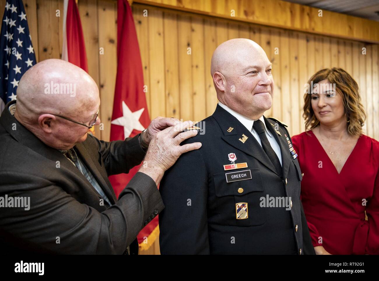 Master Sgt. (Ret.) Gerald Creech pins the rank of O6 onto his son Kevin ...