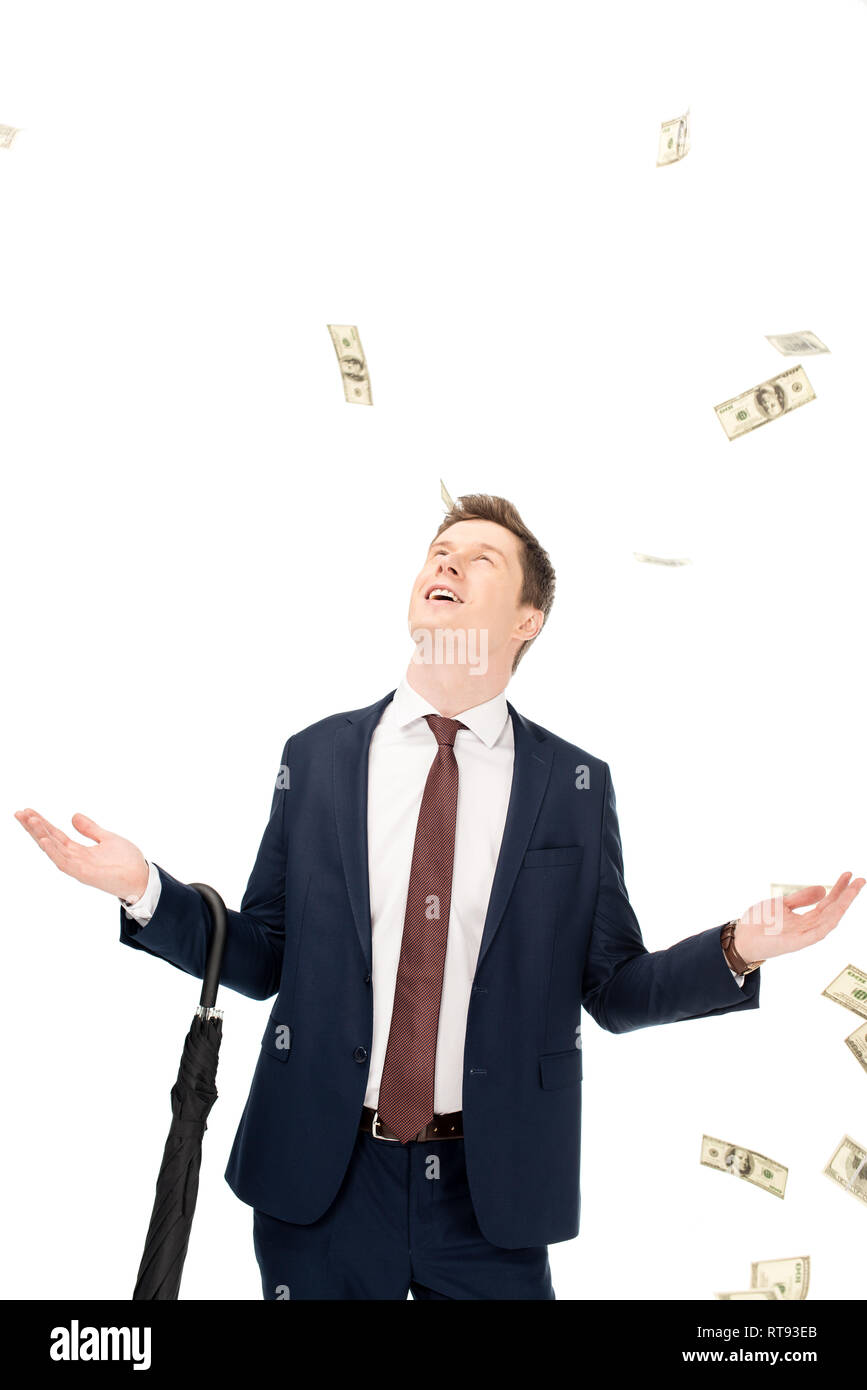 successful businessman with falling dollar banknotes isolated on white ...