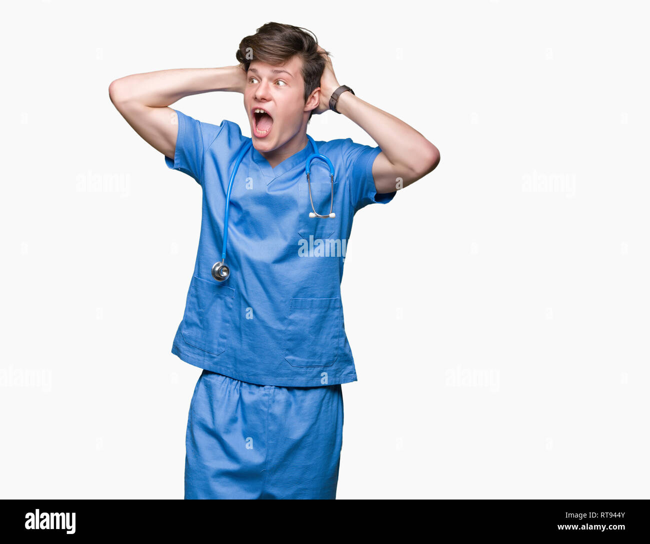 Young doctor wearing medical uniform over isolated background Crazy and ...