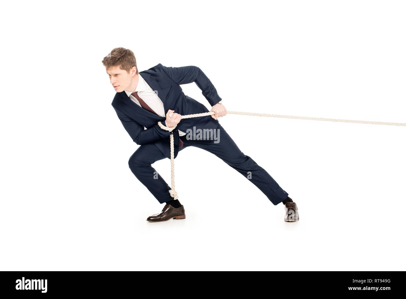 young businessman in suit pulling rope isolated on white Stock Photo ...