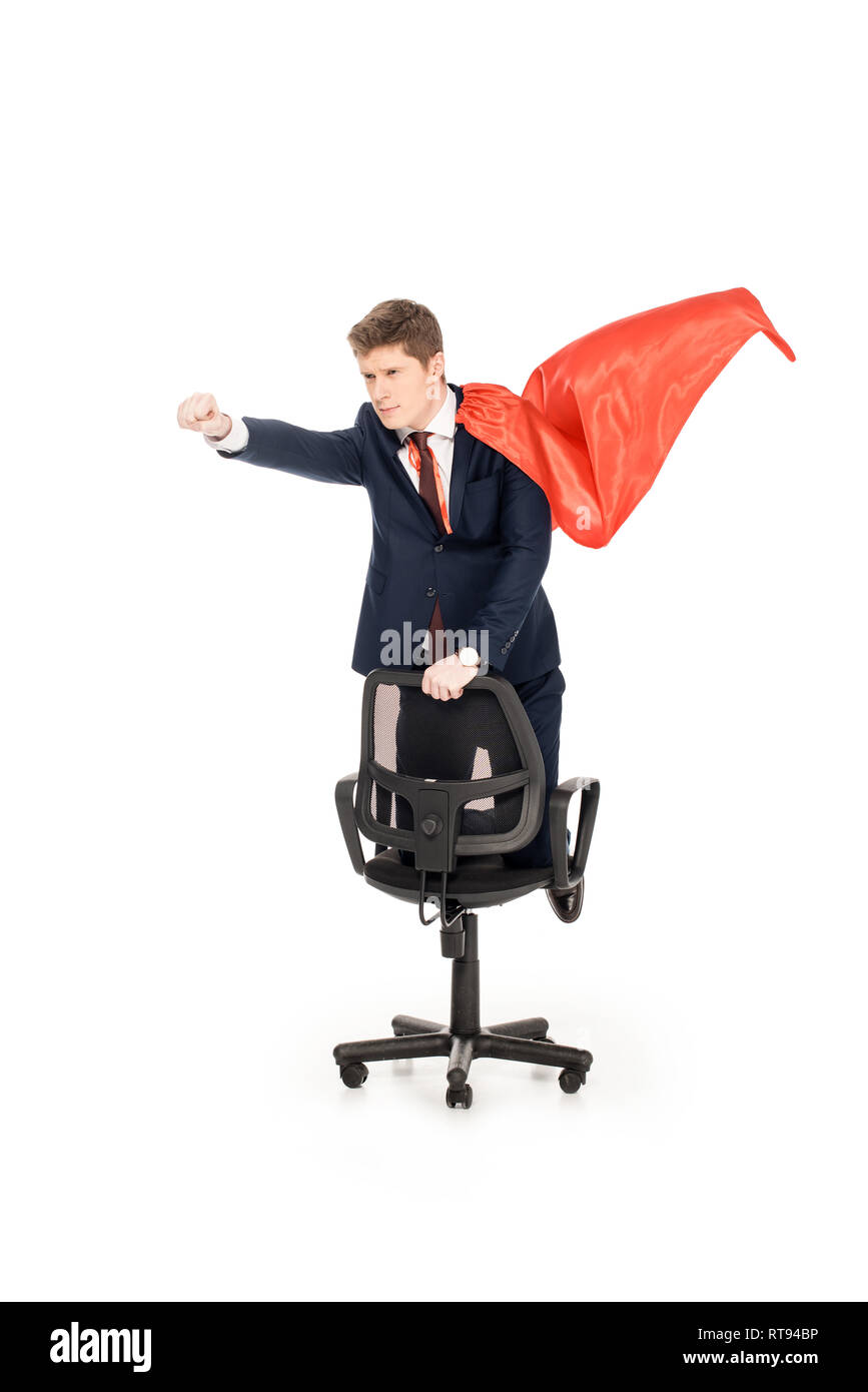 super businessman in red cloak riding chair isolated on white Stock ...