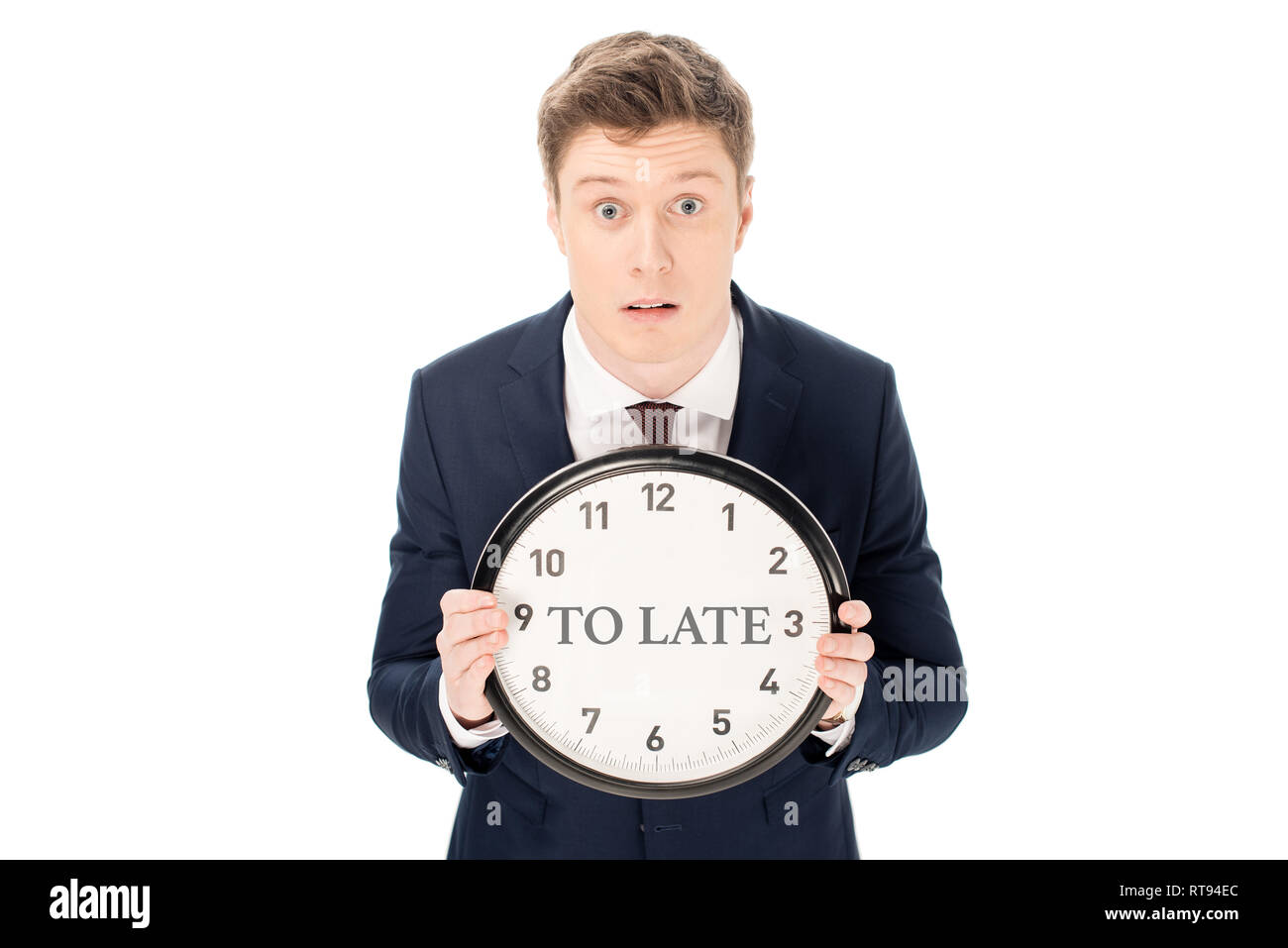 shocked businessman holding clock with "to late" lettering isolated on ...