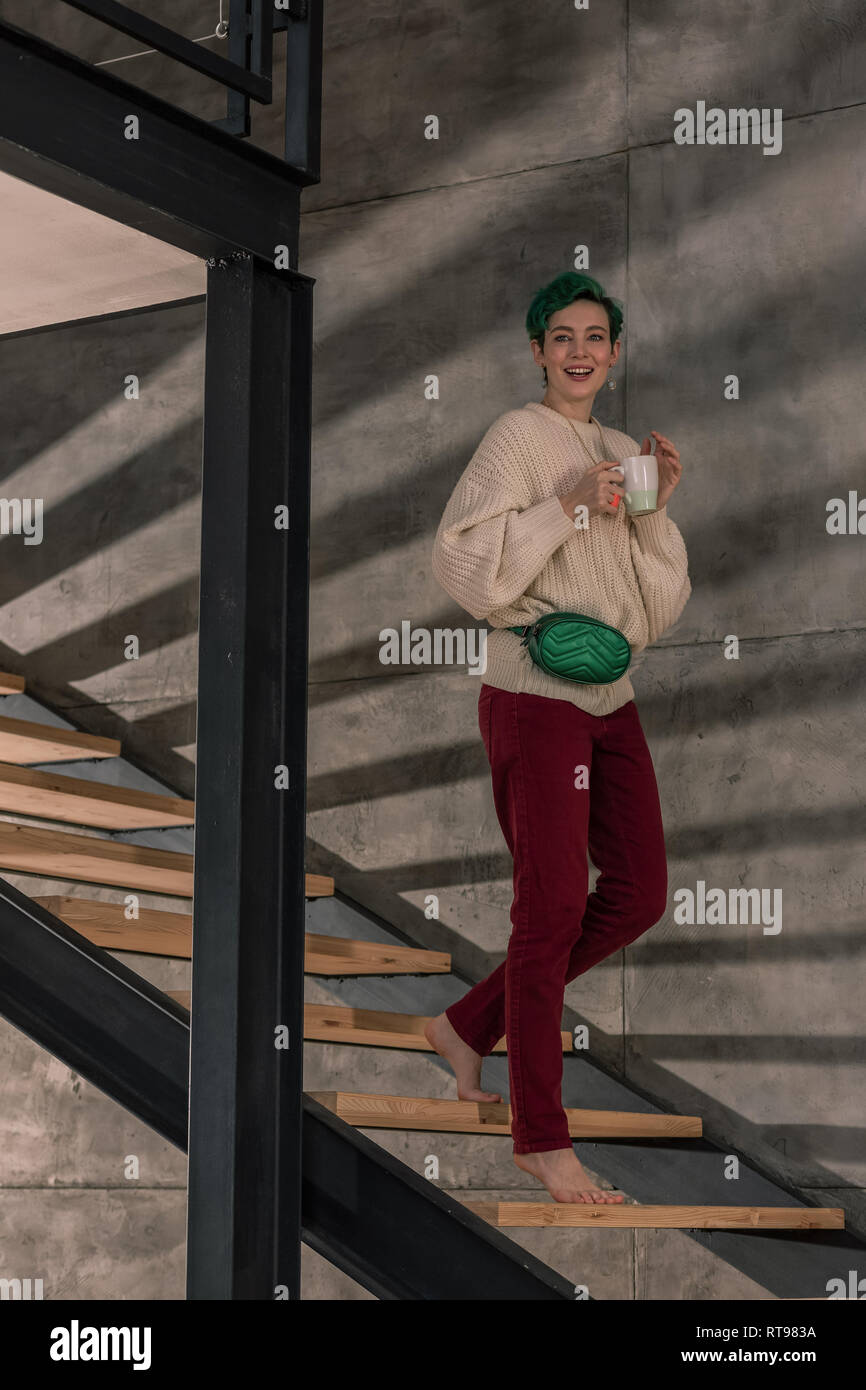 Stylish young woman and stairs hi-res stock photography and images - Alamy