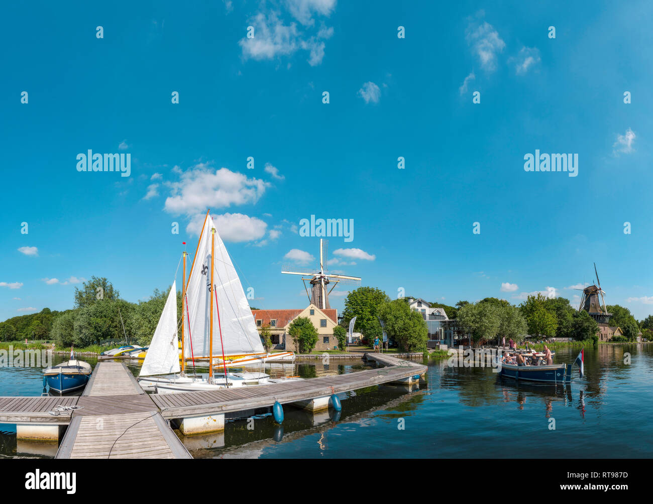 Windmills “De Lelie” and “De Ster” at the border of Lake Kralingen ...
