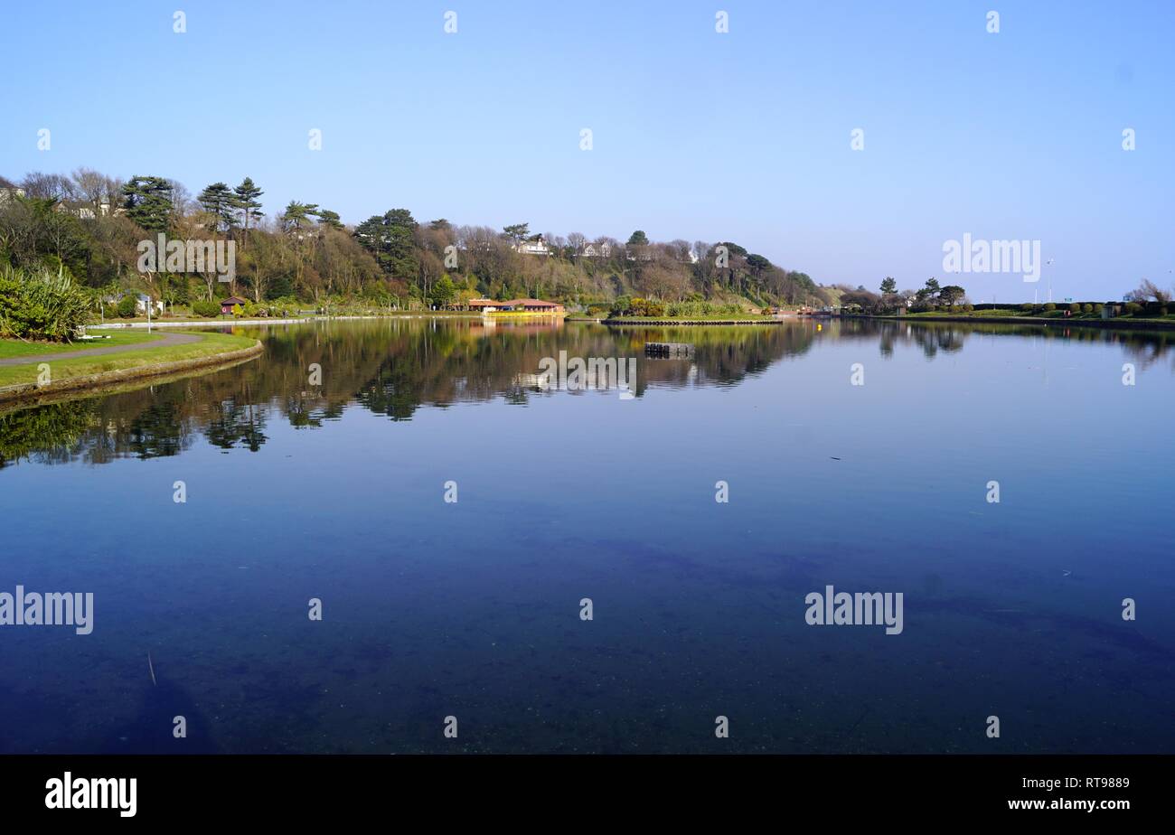 Beautiful reflections in the water at Mooragh Park, Ramsey, Isle of Man ...