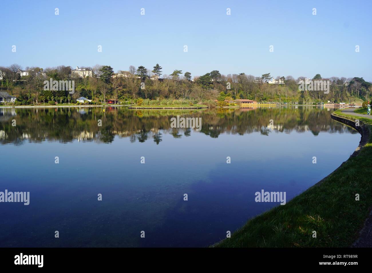 Beautiful reflections in the water at Mooragh Park, Ramsey, Isle of Man ...