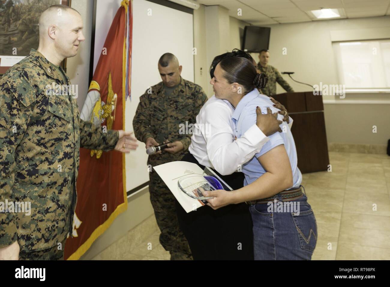 Holding her awards and gifts as Noncommissioned Officer of the Year ...