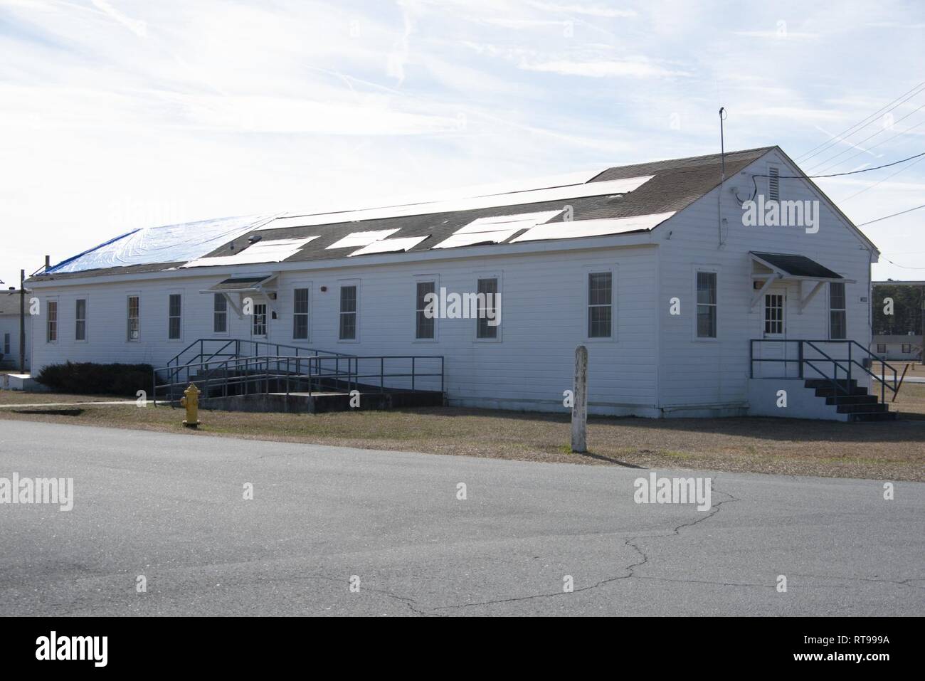 A view of the damages to the exterior of building M100 at Camp Johnson ...