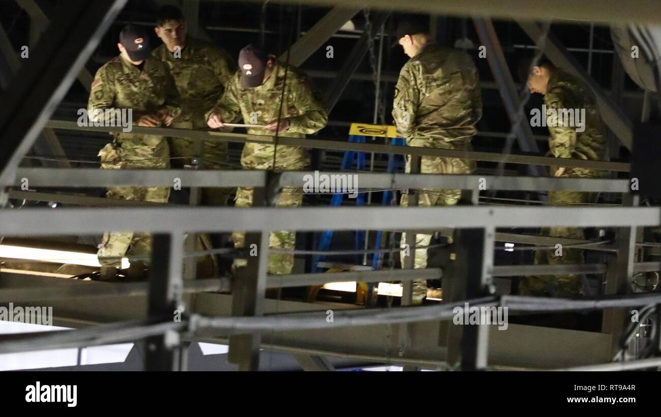 Instructors at The Sabalauski Air Assault School assess anchor points ...