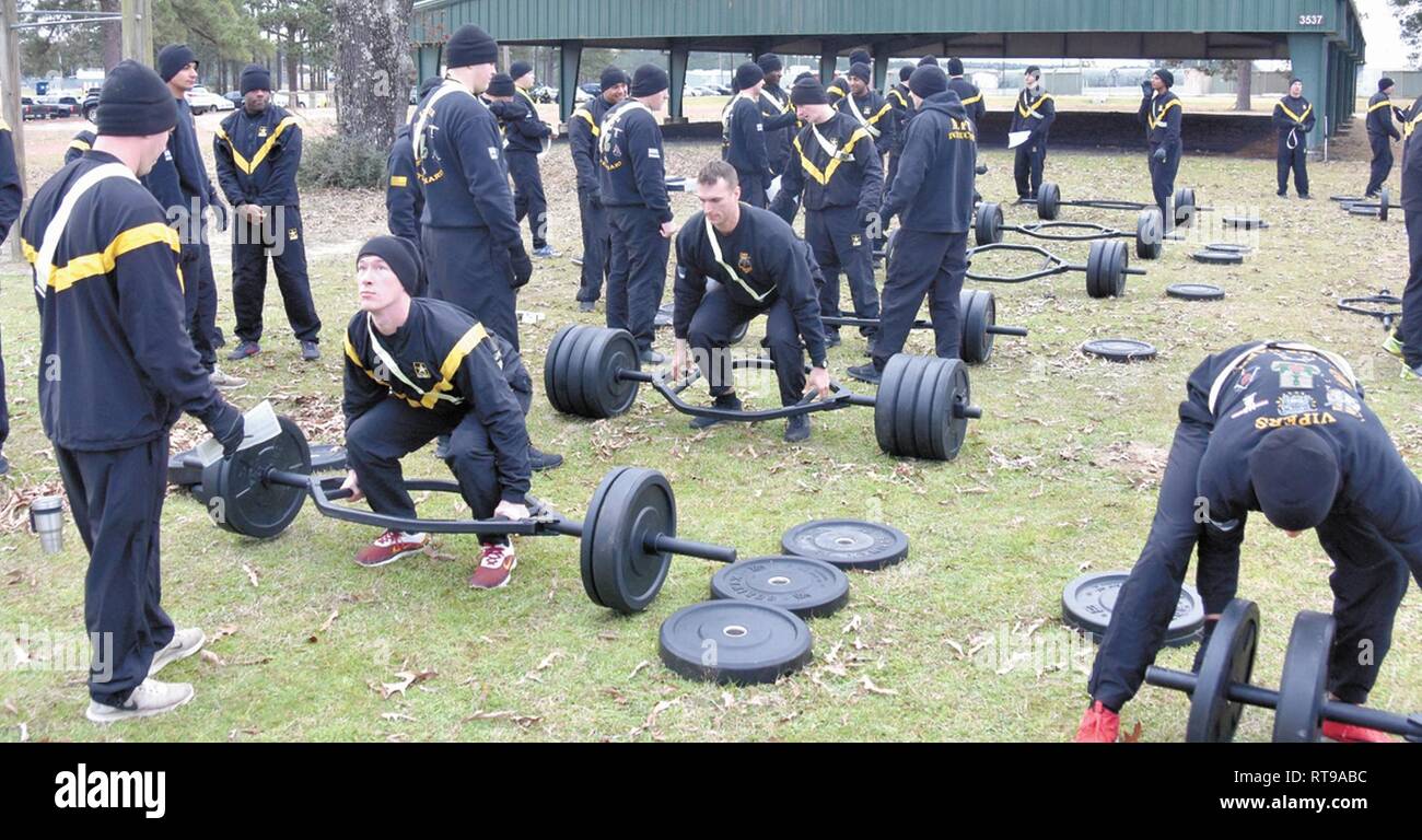 Soldiers warm up for the strength deadlift phase of the ACFT. Other ...