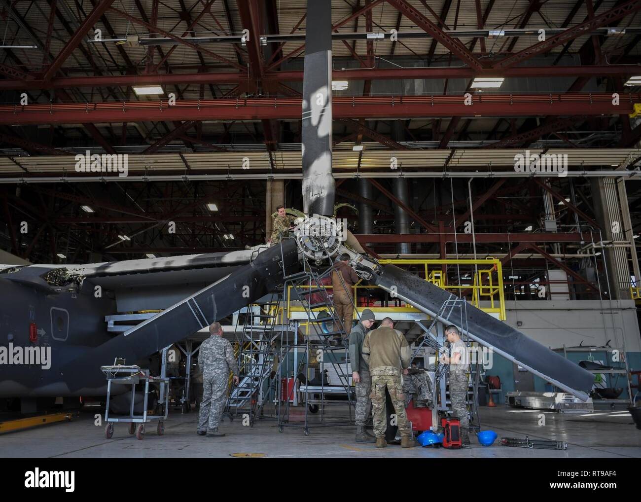 Members of the 71st Aircraft Maintenance Unit work on a CV-22 Osprey ...