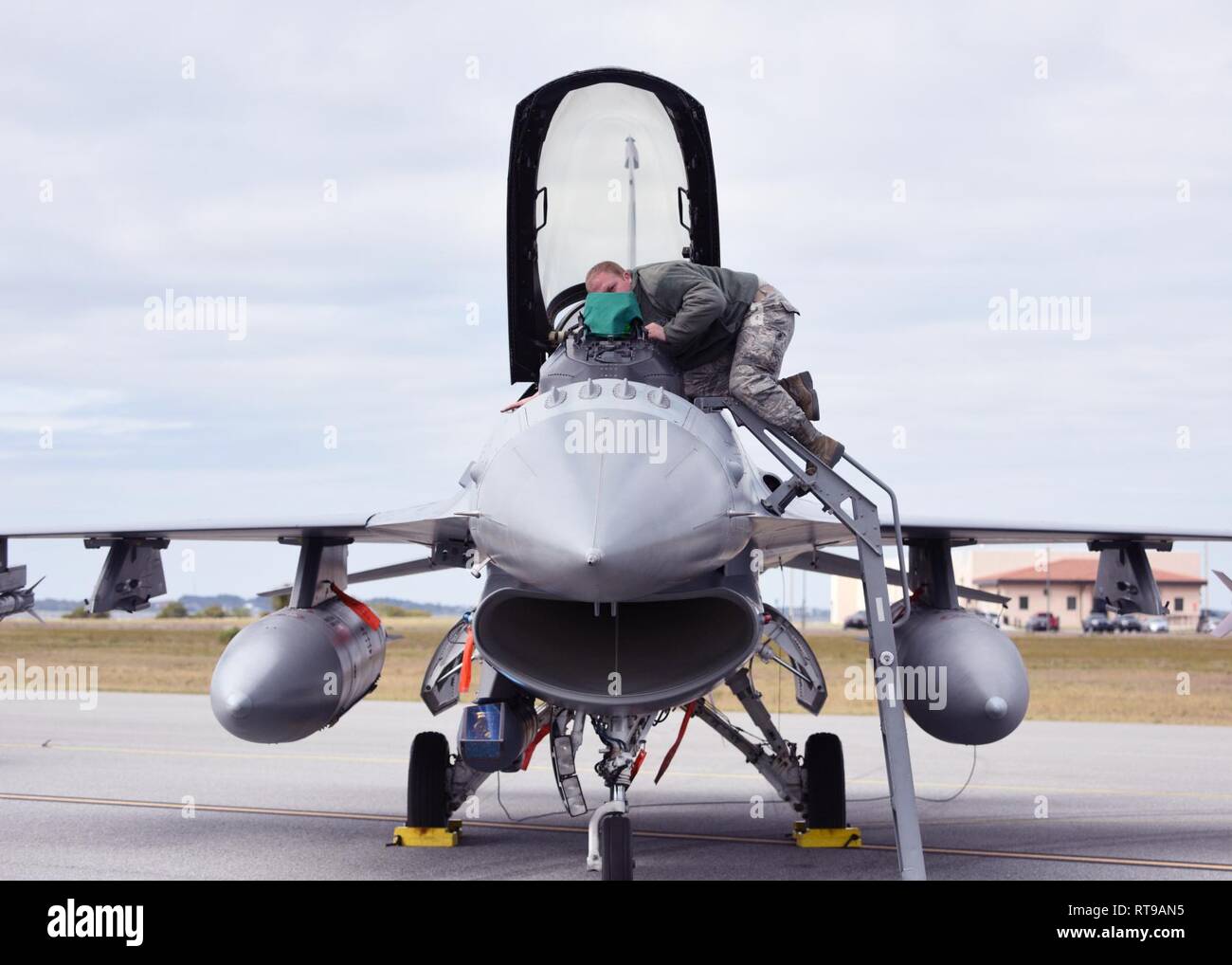 Senior Airman Tyler Smith, maintainer, performs pre-flight inspections ...