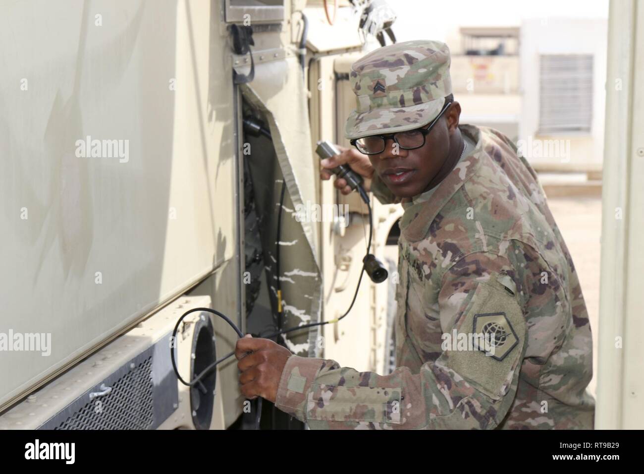 U.S. Army Sgt. Julius Forde, assigned to the 98th Expeditionary Signal ...