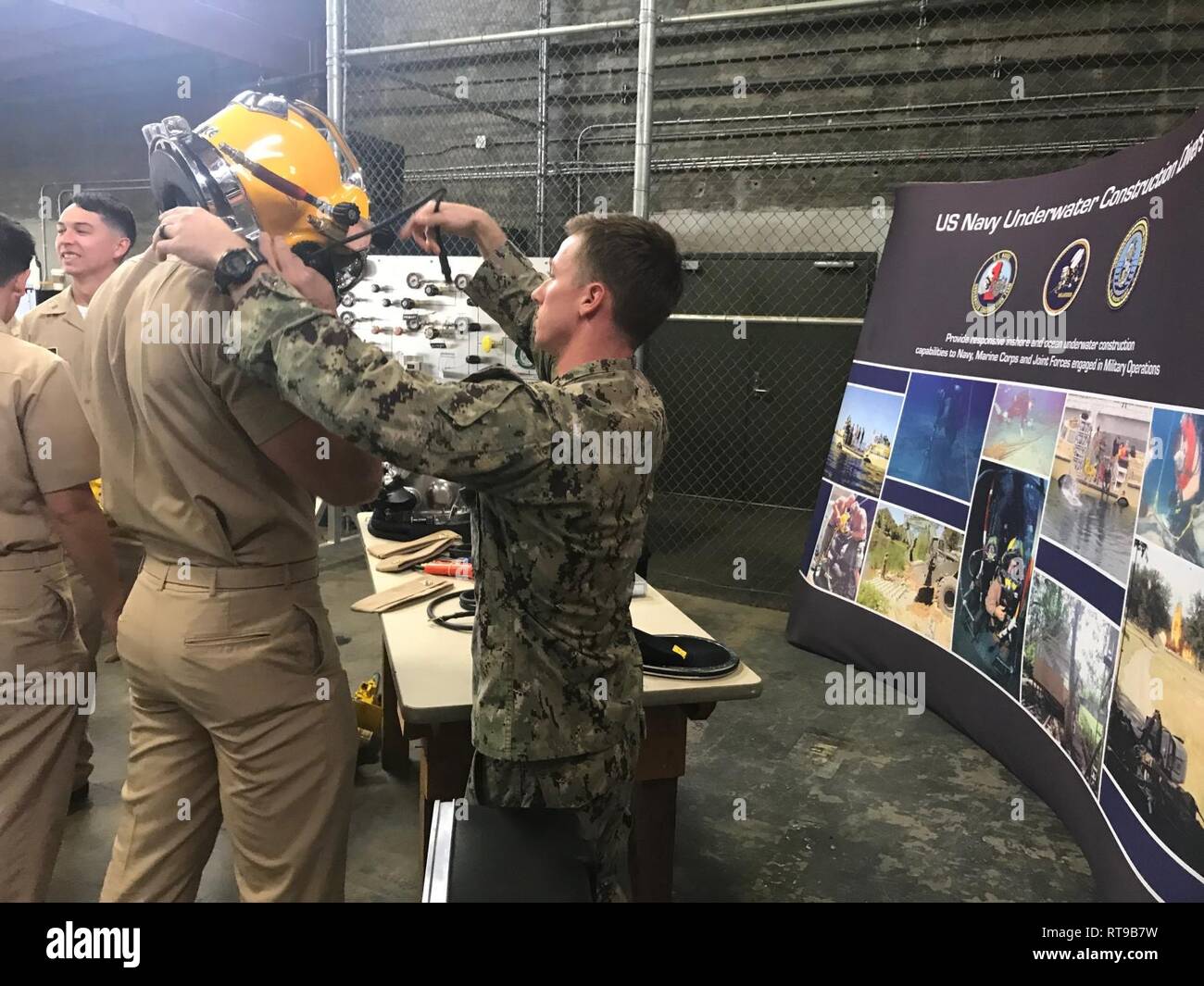 U.S. Navy Lt. Zachary Niezgodski, assigned to Underwater Construction ...
