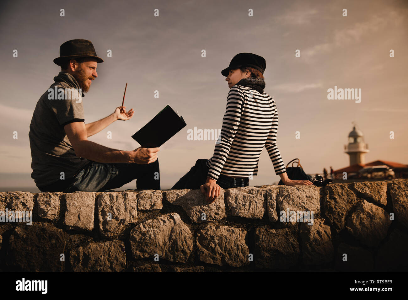 Man sitting smoking pipe woman hi-res stock photography and images - Alamy